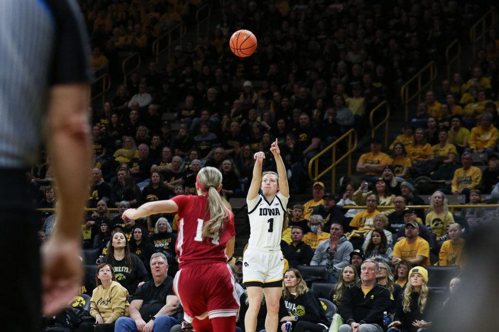 Molly Davis, headband and all, playing huge for Iowa women - Hawk Fanatic